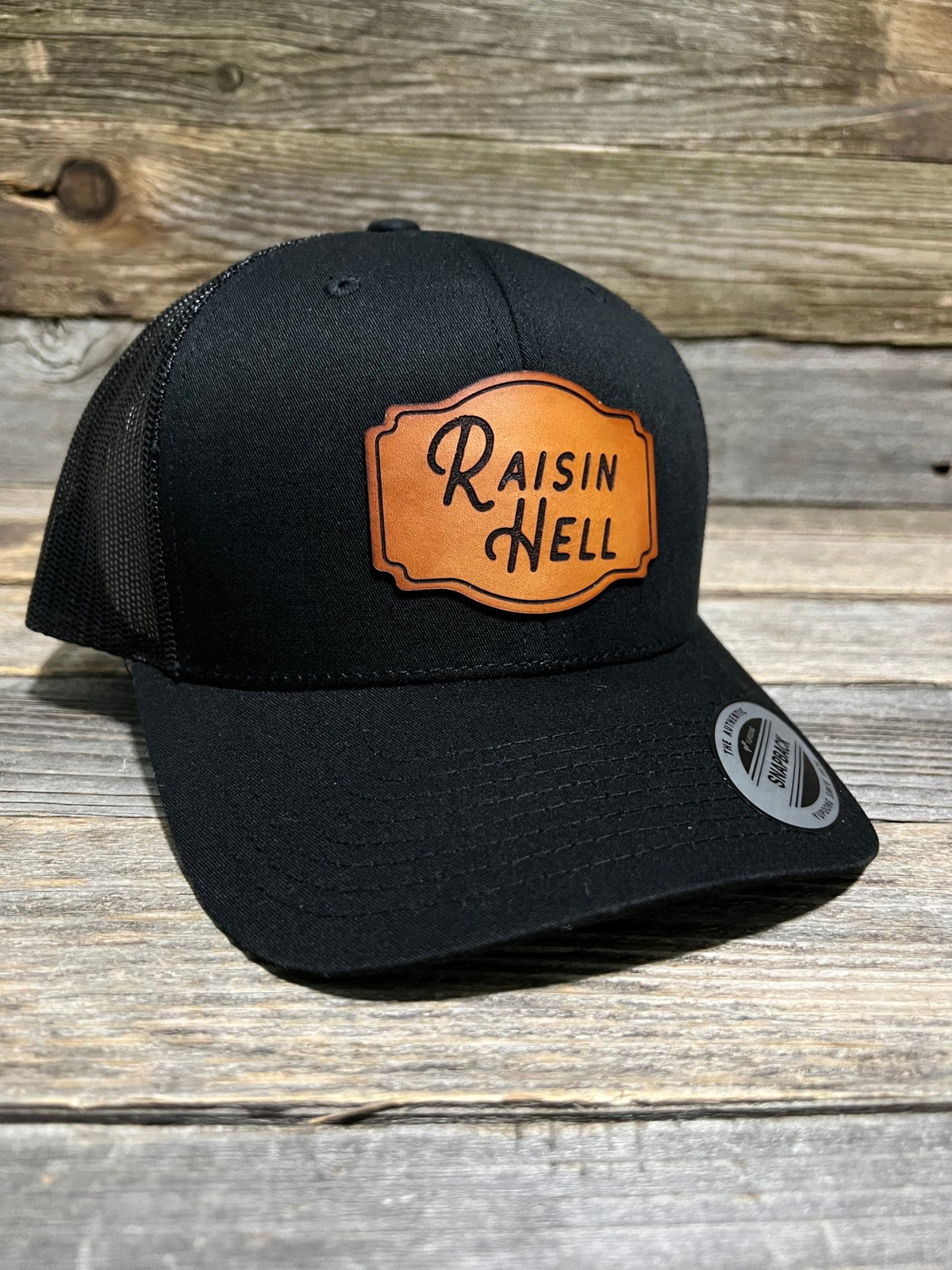 Raisin Hell Leather Patch Trucker Hat — Savannah Moss Co.